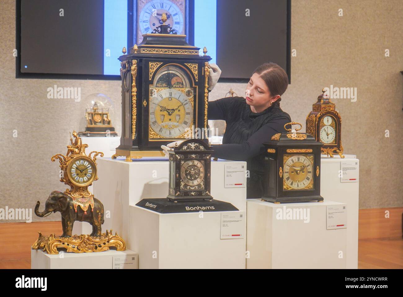 London, UK. 25 November 2024 An art handler with a fine mid 18th ...