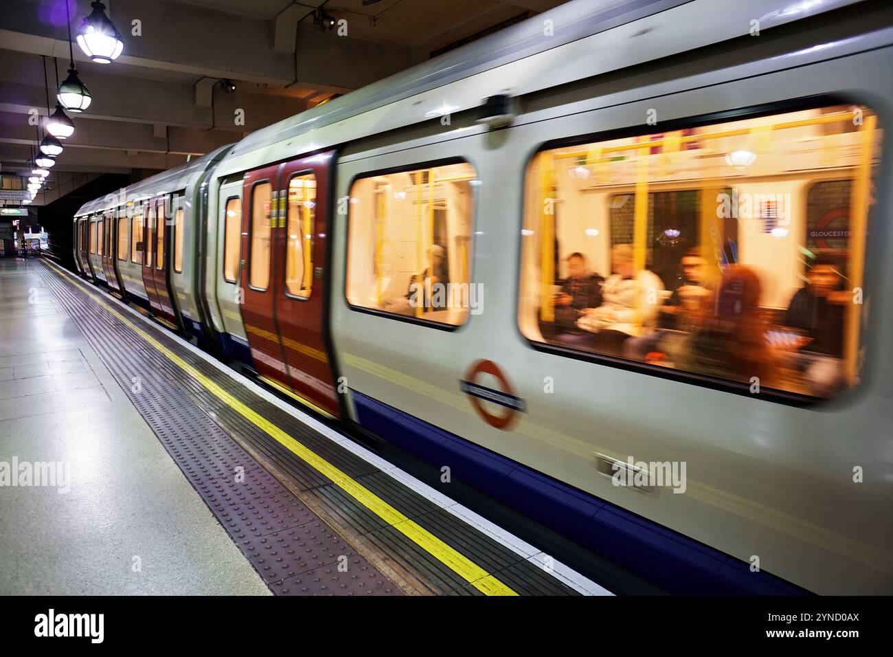 LONDON, England — A London Underground train departs from a station ...