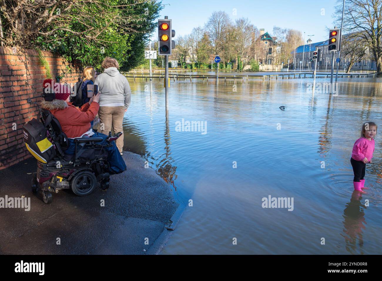 Chippenham, Wiltshire, UK, 25th Nov, 2024. A woman is pictured taking a ...