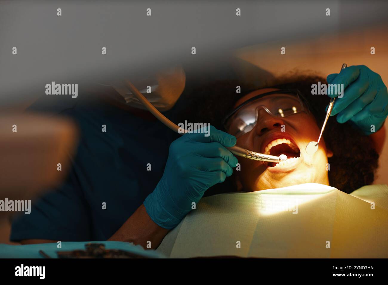 Performing Exam with Specialized Dental Equipment Stock Photo - Alamy