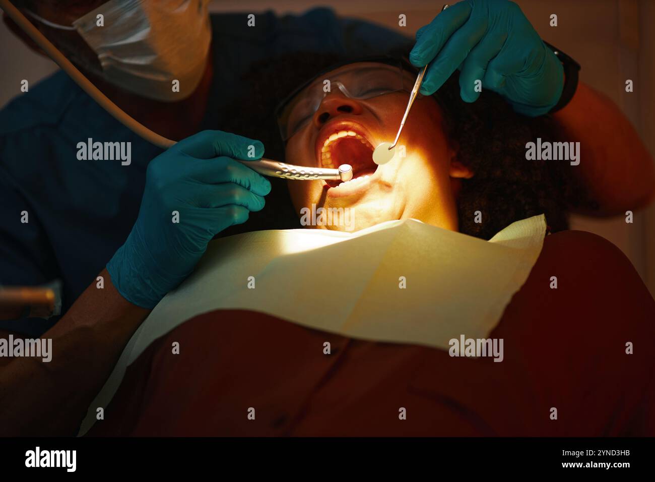 Dentist Treating Patient with Dental Tools during Procedure Stock Photo ...