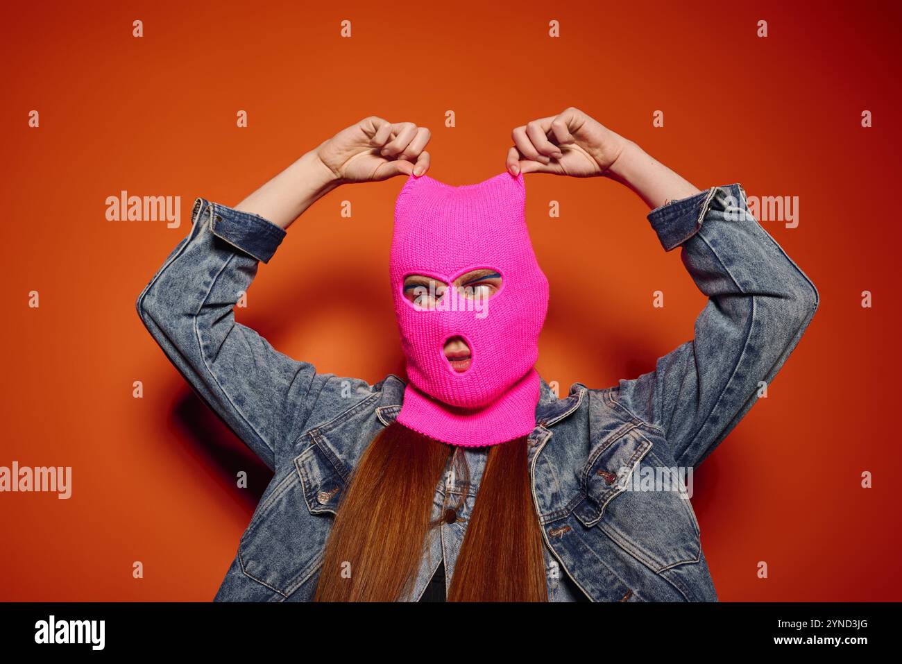 Emotional young man showcases vibrant feelings while wearing a striking ...
