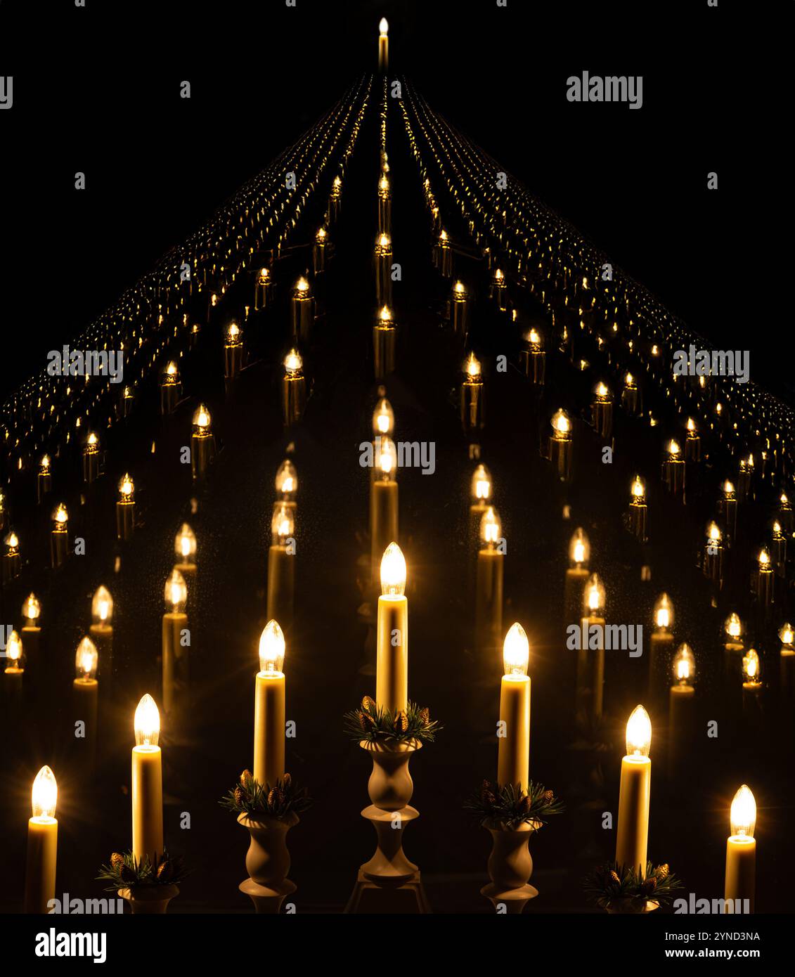 Candlesticks create a reflection in long rows in the window Stock Photo ...