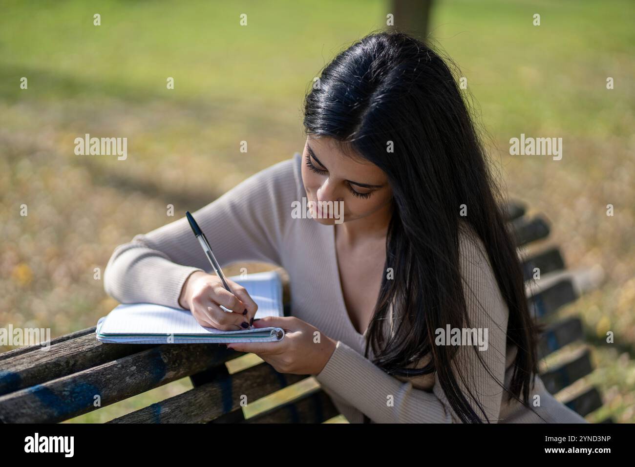 Student taking notes outdoors hi-res stock photography and images - Alamy