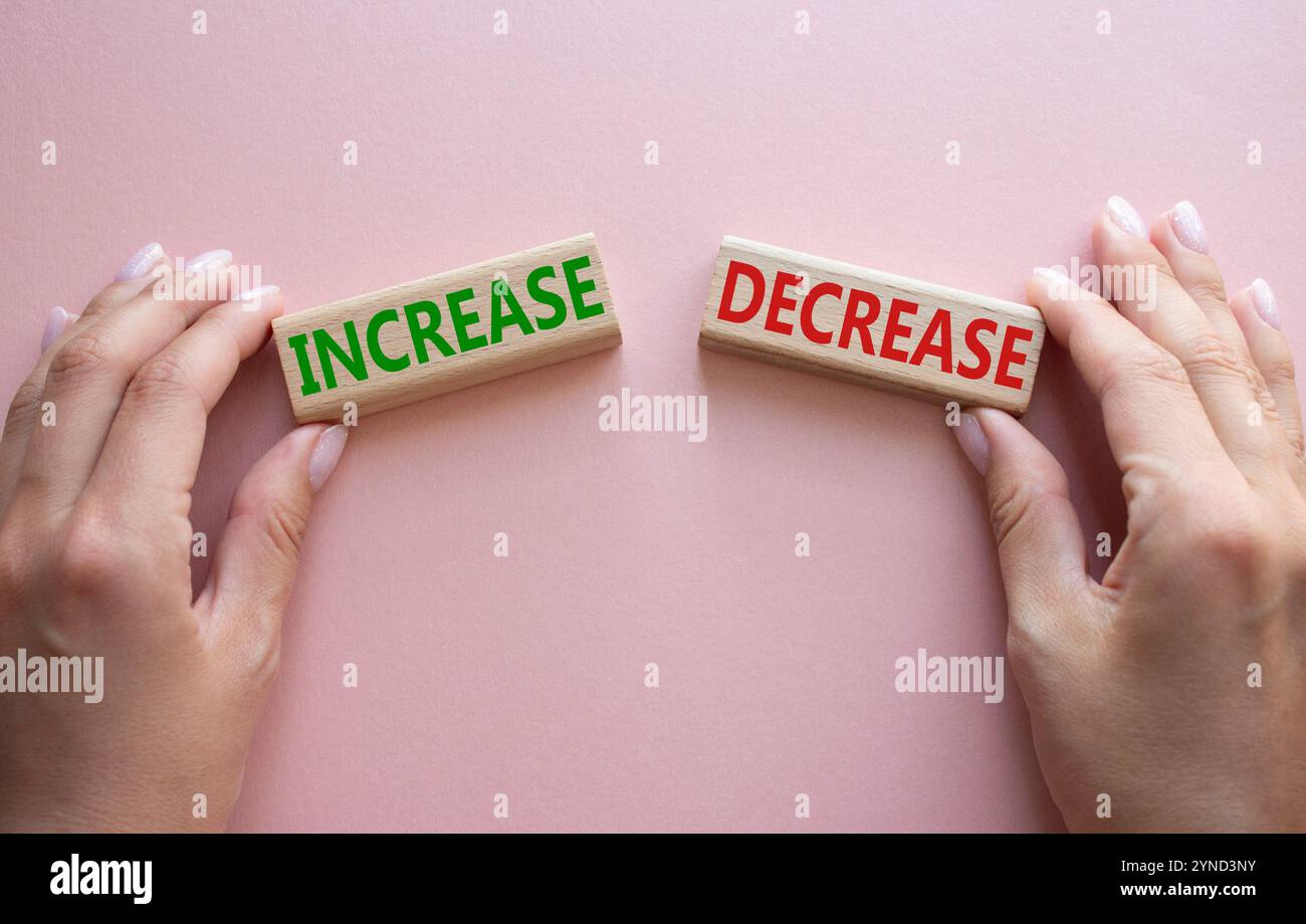Increase or Decrease symbol. Concept word Increase or Decrease on wooden blocks. Businessman ...