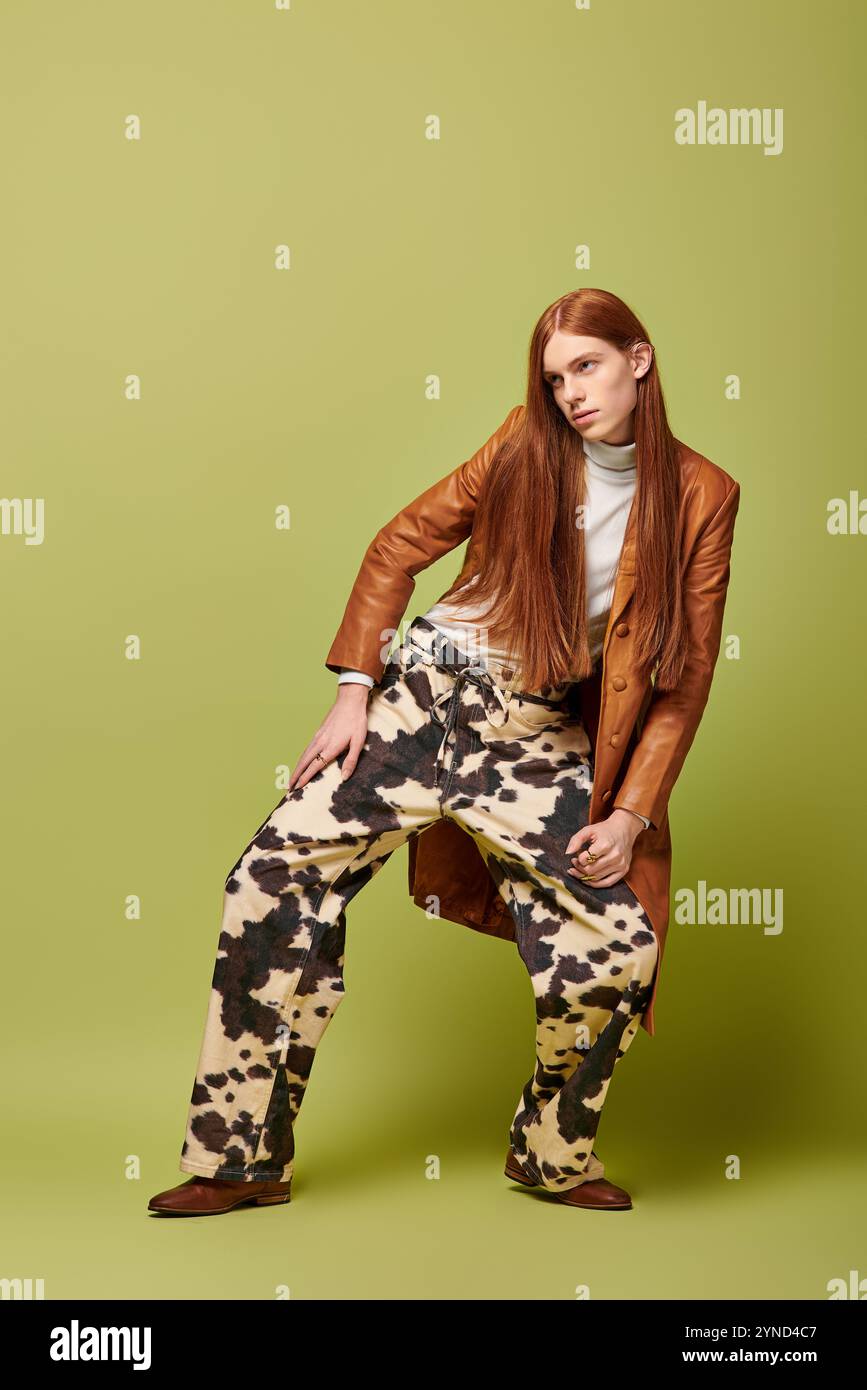 A young man with long red hair exhibits deep emotions while striking a unique pose Stock Photo ...