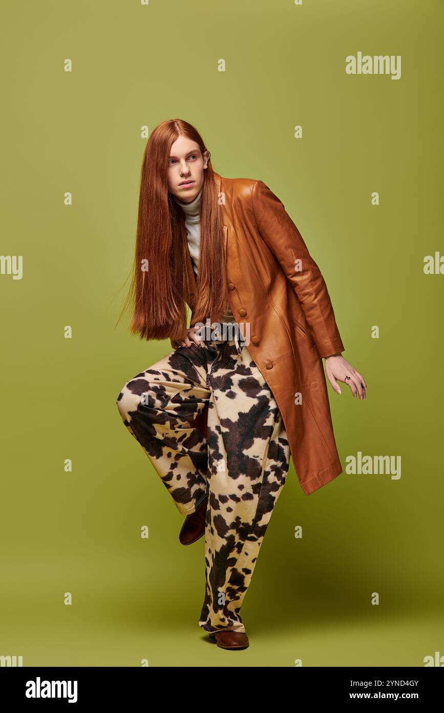 Emotional young man showcases his unique fashion sense in a striking ...