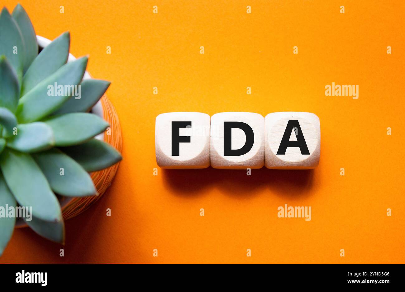FDA - Food Drug Administration symbol. Wooden cubes with word FDA ...