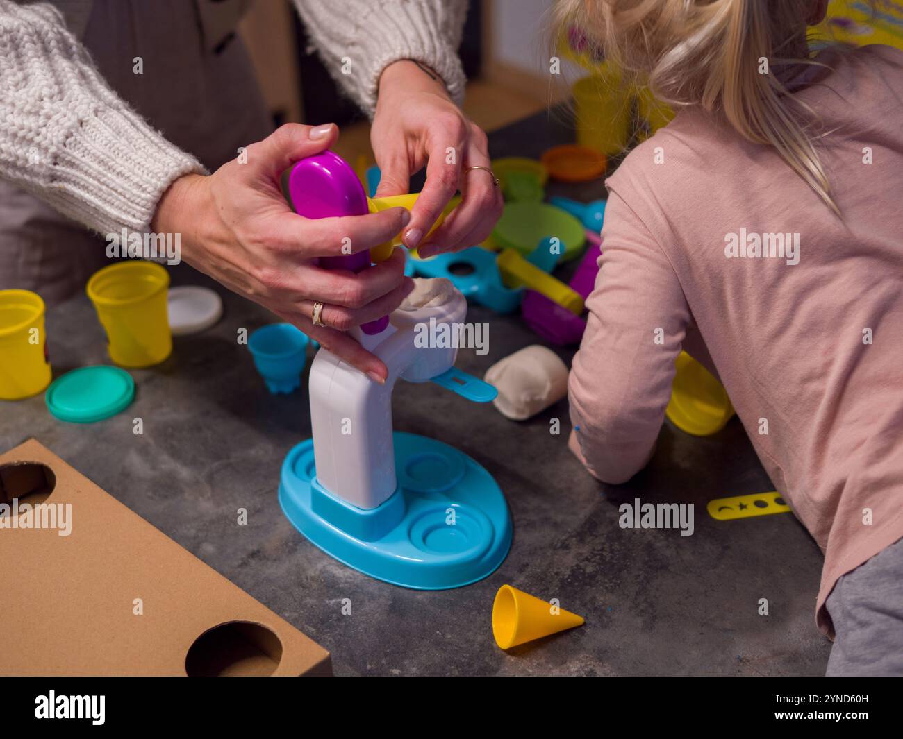 Mother daughter bonding over toys hi-res stock photography and images ...