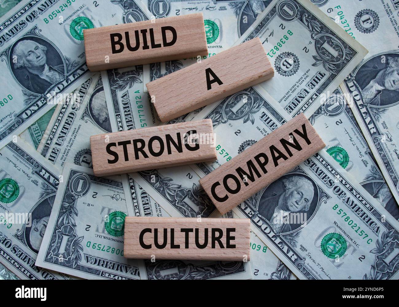 Company culture symbol. Wooden blocks with words Build a strong company ...