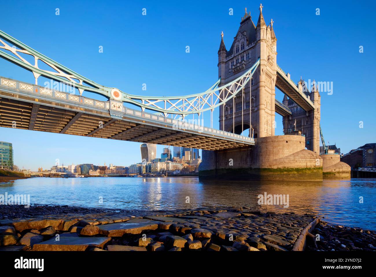 Tower Bridge, River Thames and London city skyline from Thames beach ...