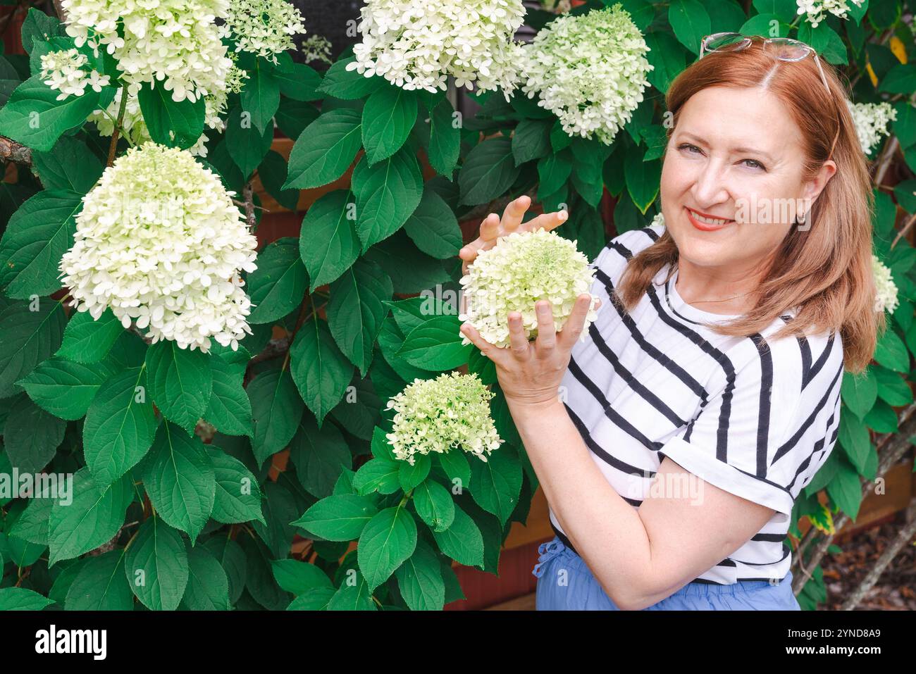 Beautiful mature woman bush panicle hi-res stock photography and images - Alamy