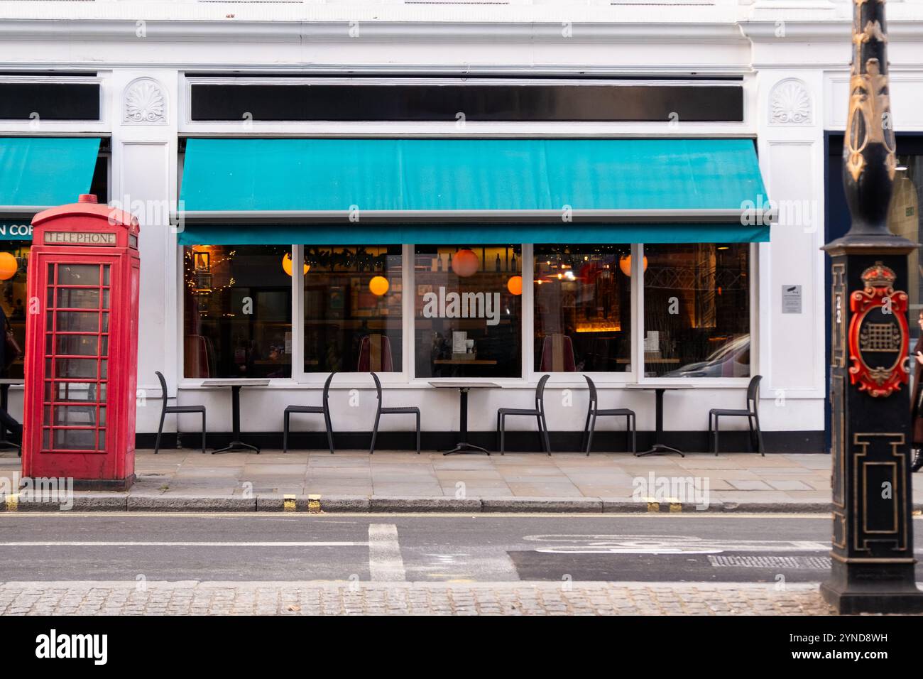 LONDON- Typical restaurant premises in central London with red phone ...