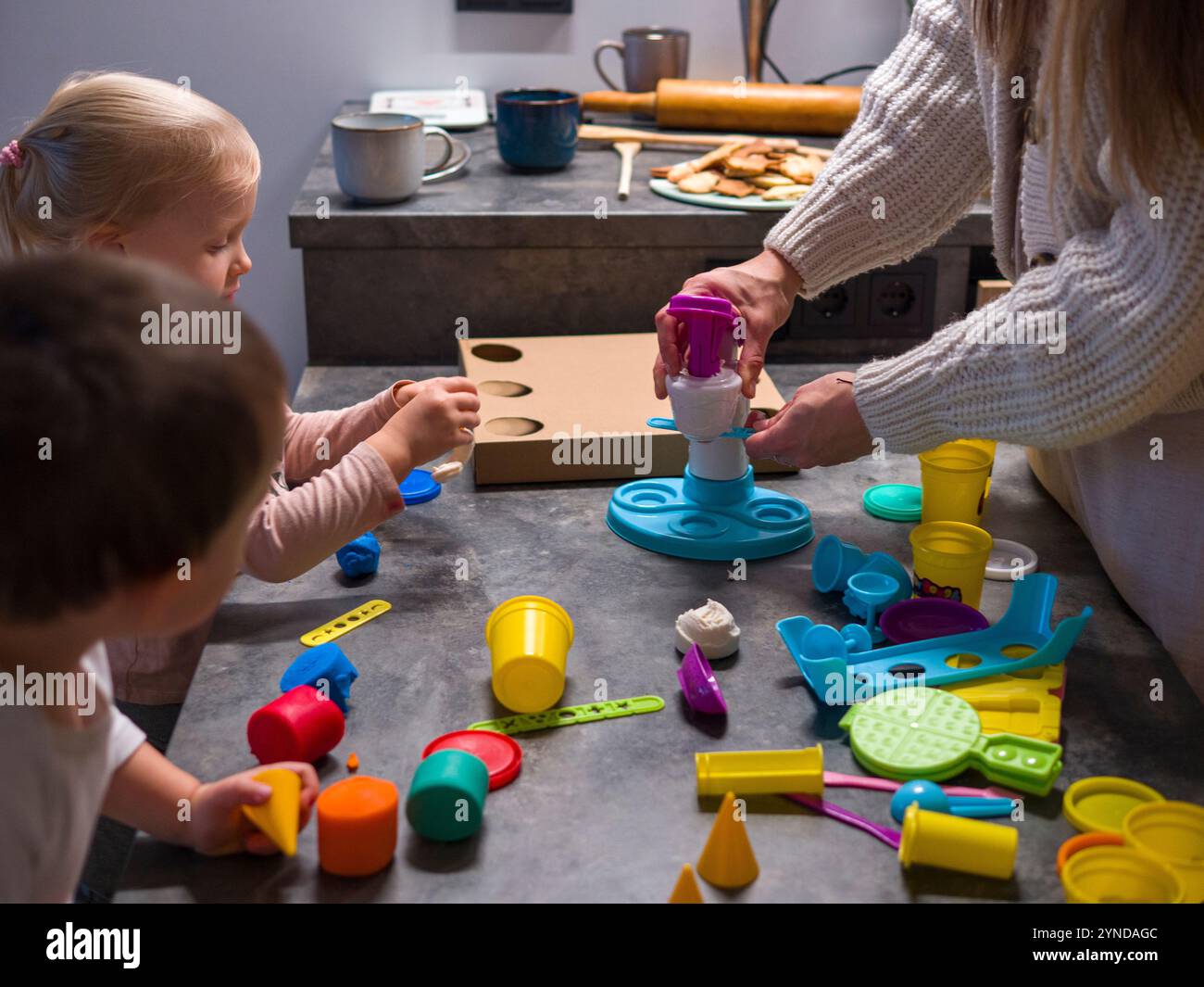 Family playing modeling clay in hi-res stock photography and images - Alamy