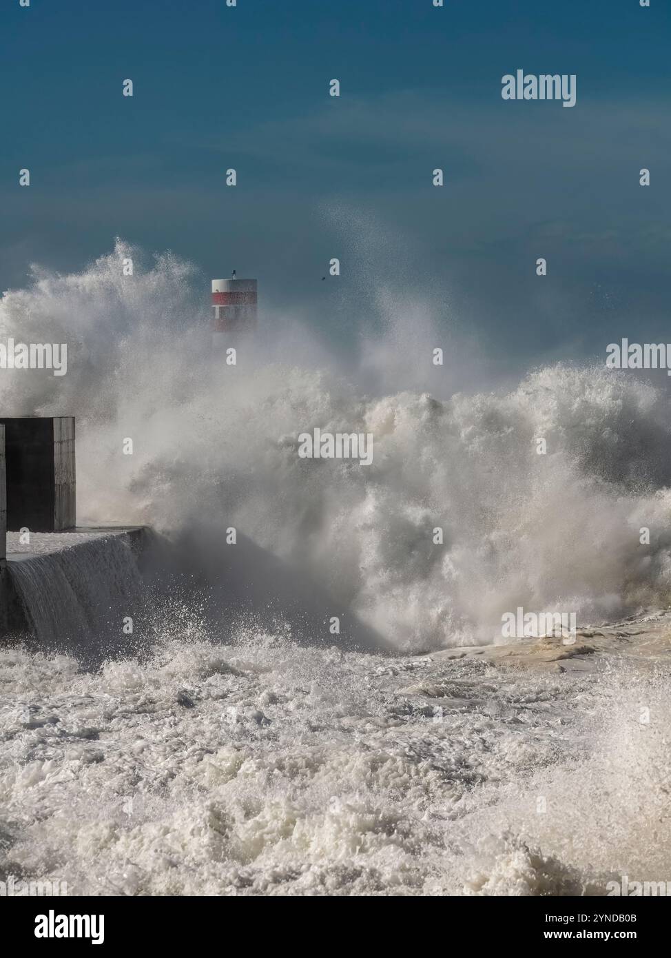 Huge wave splash over a pier and beacon from northern portuguese coast ...