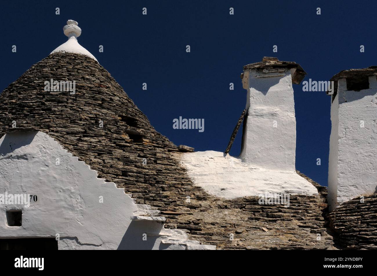 Roof cone and tall chimney on restored trullo in Alberobello, Puglia ...