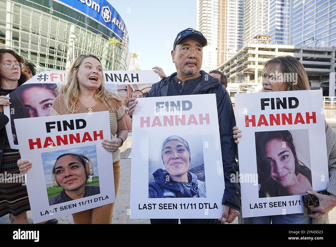 Ryan Kobayashi, center, holds a picture of his missing daughter Hannah ...