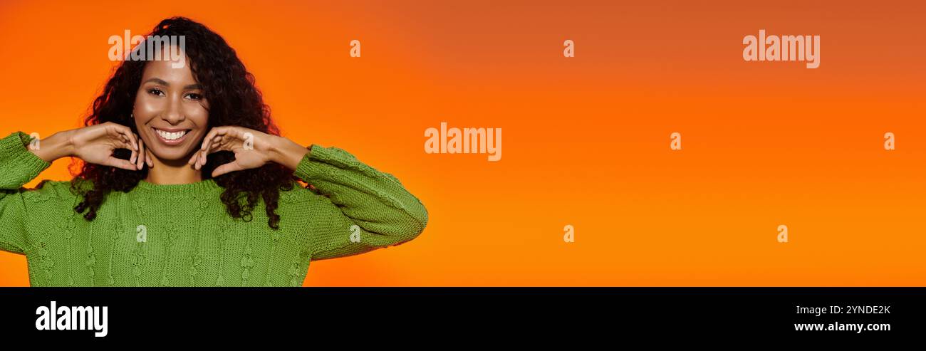 A cheerful woman showcases her joyful personality while posing with an ...