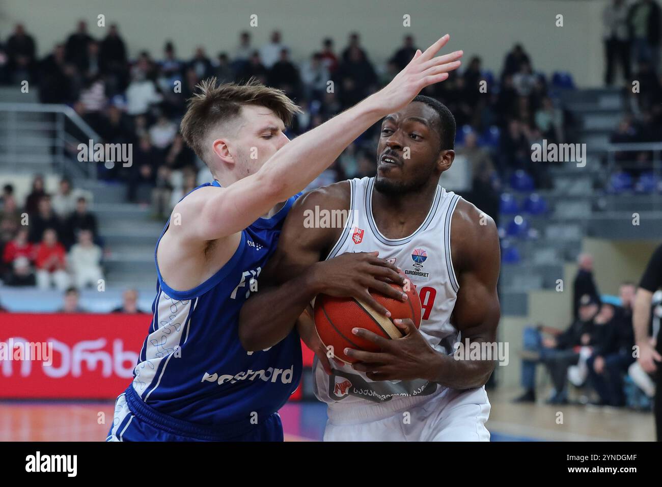 Perttu Blomgren of Finland competes for the ball with Kamar Baldwin of ...