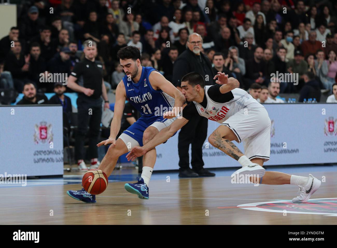 Edon Maxhuni of Finland competes for the ball with Rati Andronikashvili ...