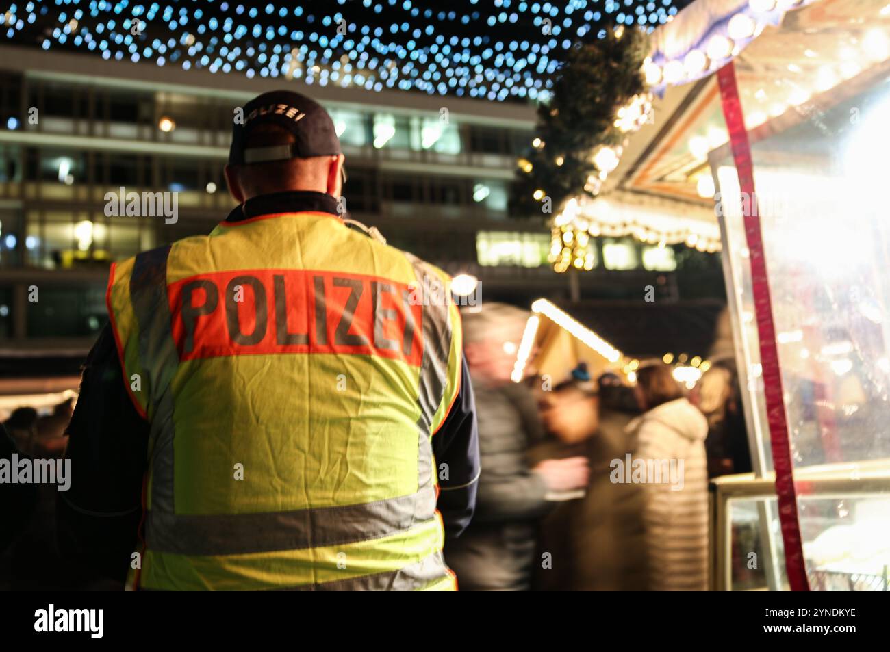 25 November 2024, Berlin: A police officer stands at the edge of a ...