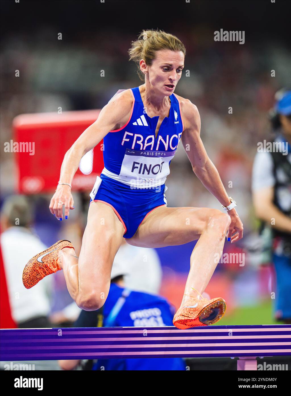 Alice Finot participating in the 3000 metres steeplechase at the Paris ...
