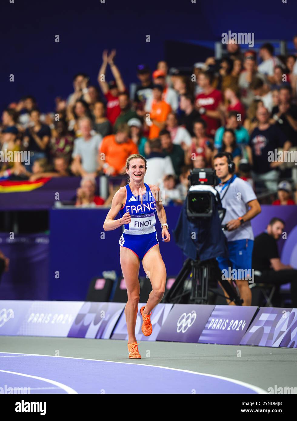 Alice Finot participating in the 3000 metres steeplechase at the Paris ...