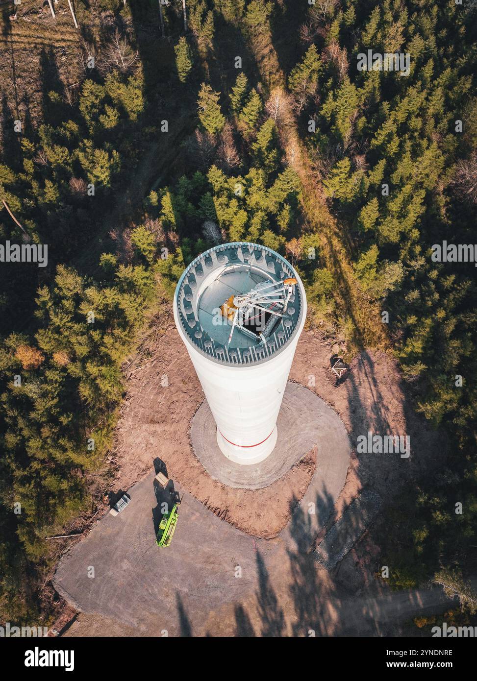 A bird's eye view of a wind turbine under construction surrounded by ...