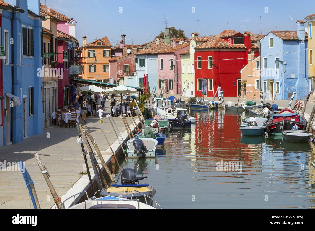 Lively place along a canal with colourful houses and terraces full of ...