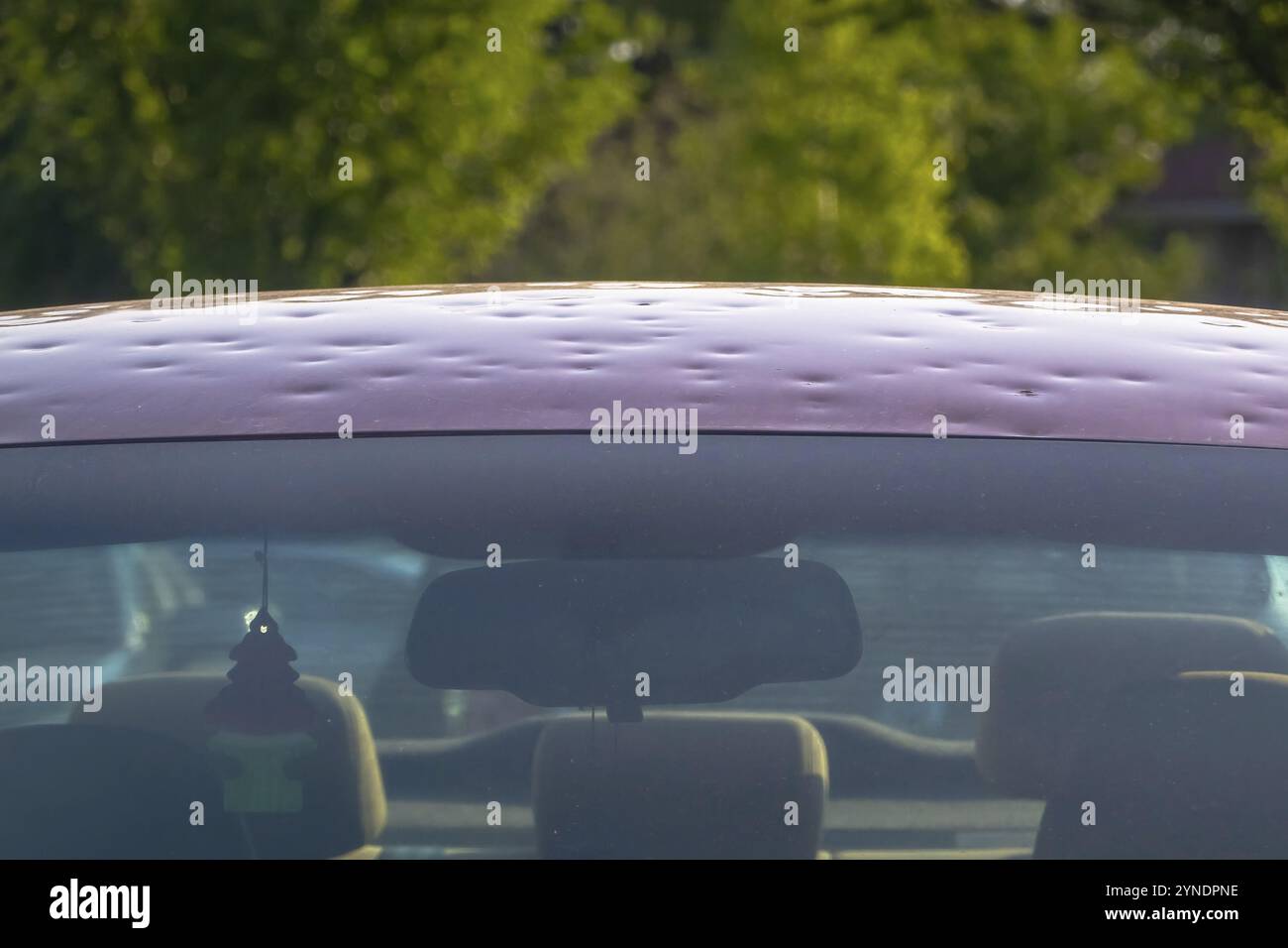 Calgary, Alberta, Canada. Jul 12, 2024. A close up to a car with hail ...