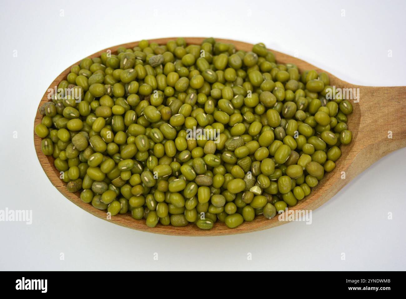 Handful of green Masha is messed in a spoon. Ukrainian abrupt spoons ...