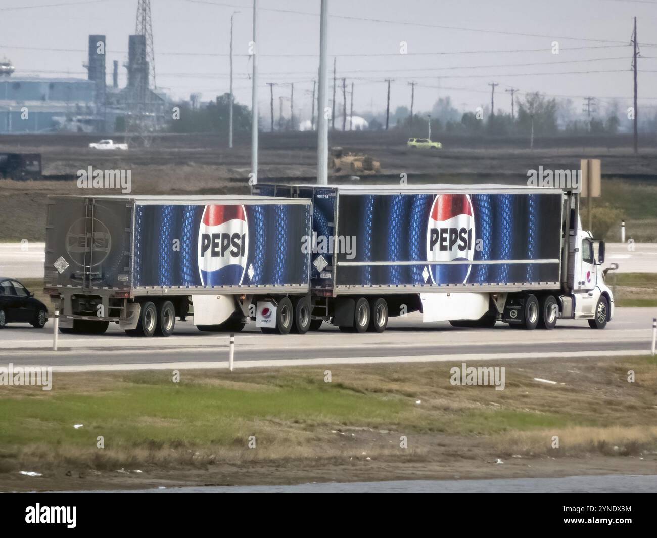 Calgary, Alberta, Canada. May 16, 2024. A Pepsi double cargo semi truck ...