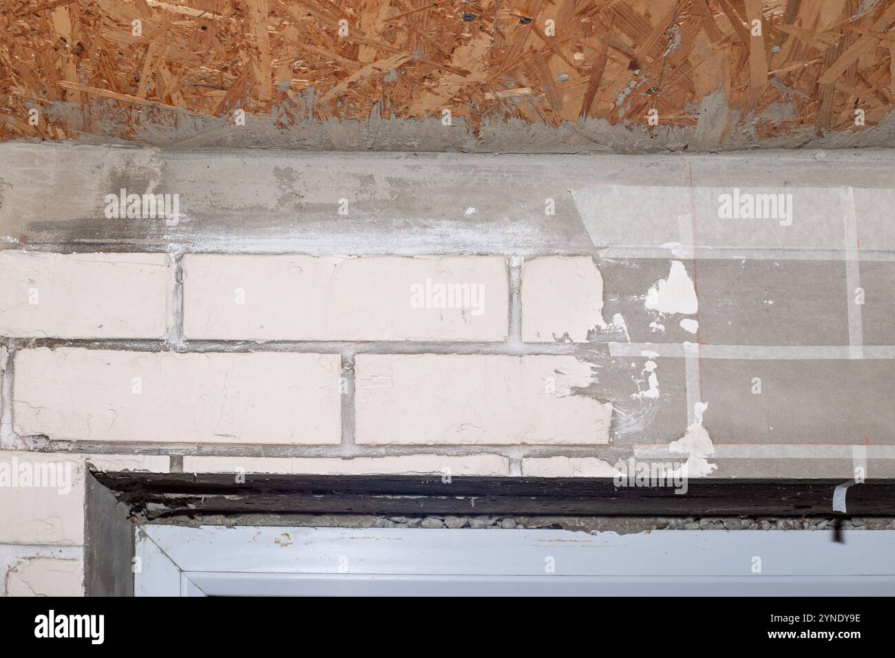 Decorative gypsum bricks. Decorative plaster is applied to the masking ...