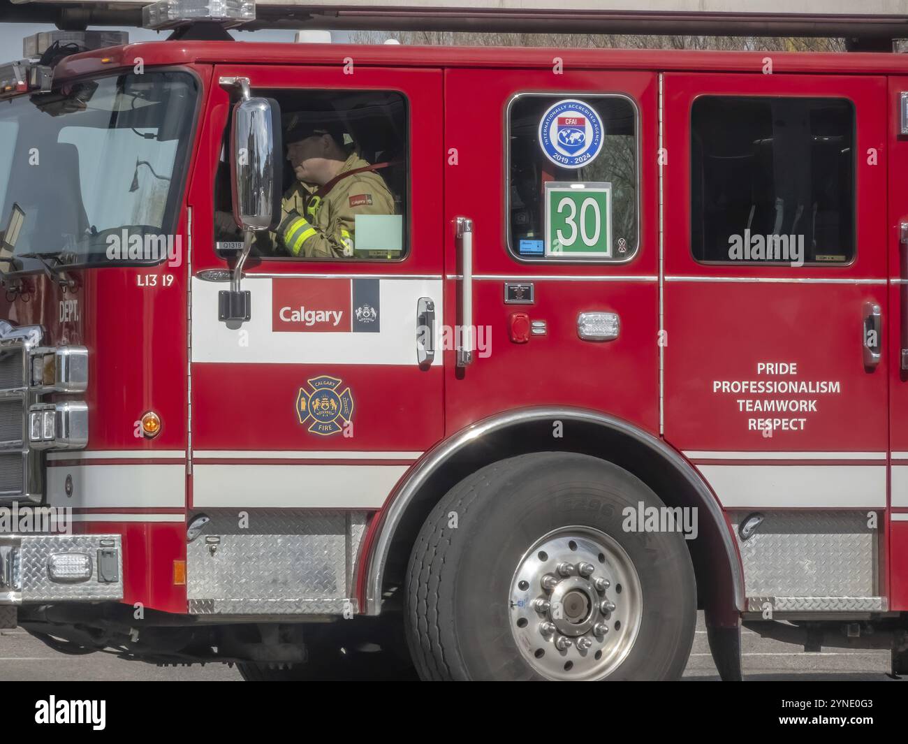Calgary, Alberta, Canada. May 10, 2024. A Firefighter driving a Calgary ...
