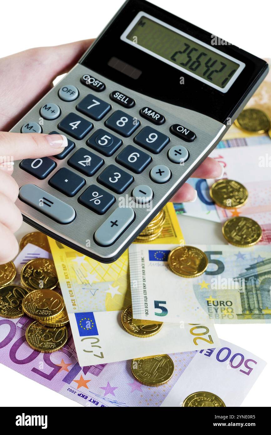 A hand with a calculator and euro banknotes, symbol photo for turnover ...