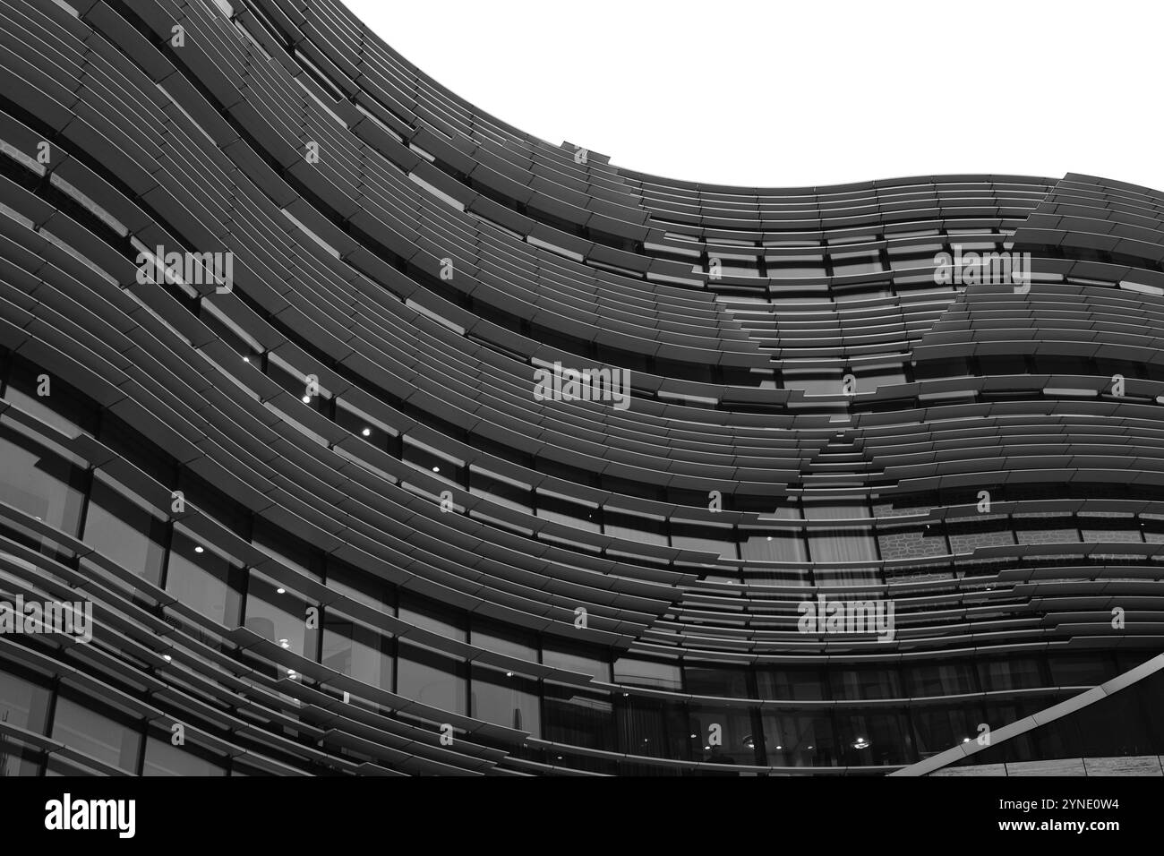 Wave-shaped building in the historic city centre, black and white ...