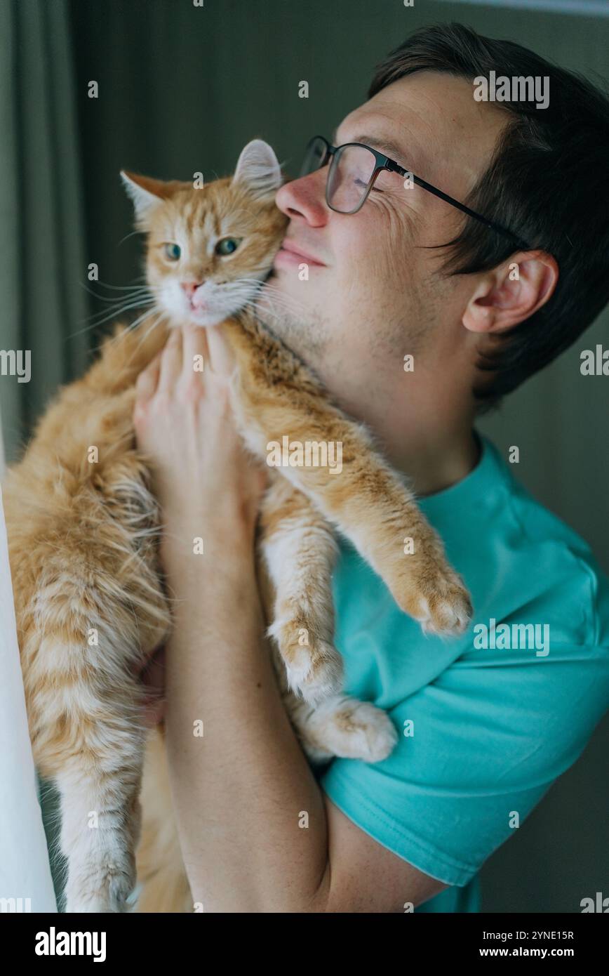 Caring vet cuddles a ginger cat in a cozy clinic, showing love and ...