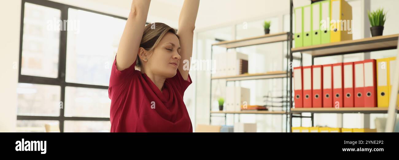 Tired woman stretches back and arms after finishing report Stock Photo ...