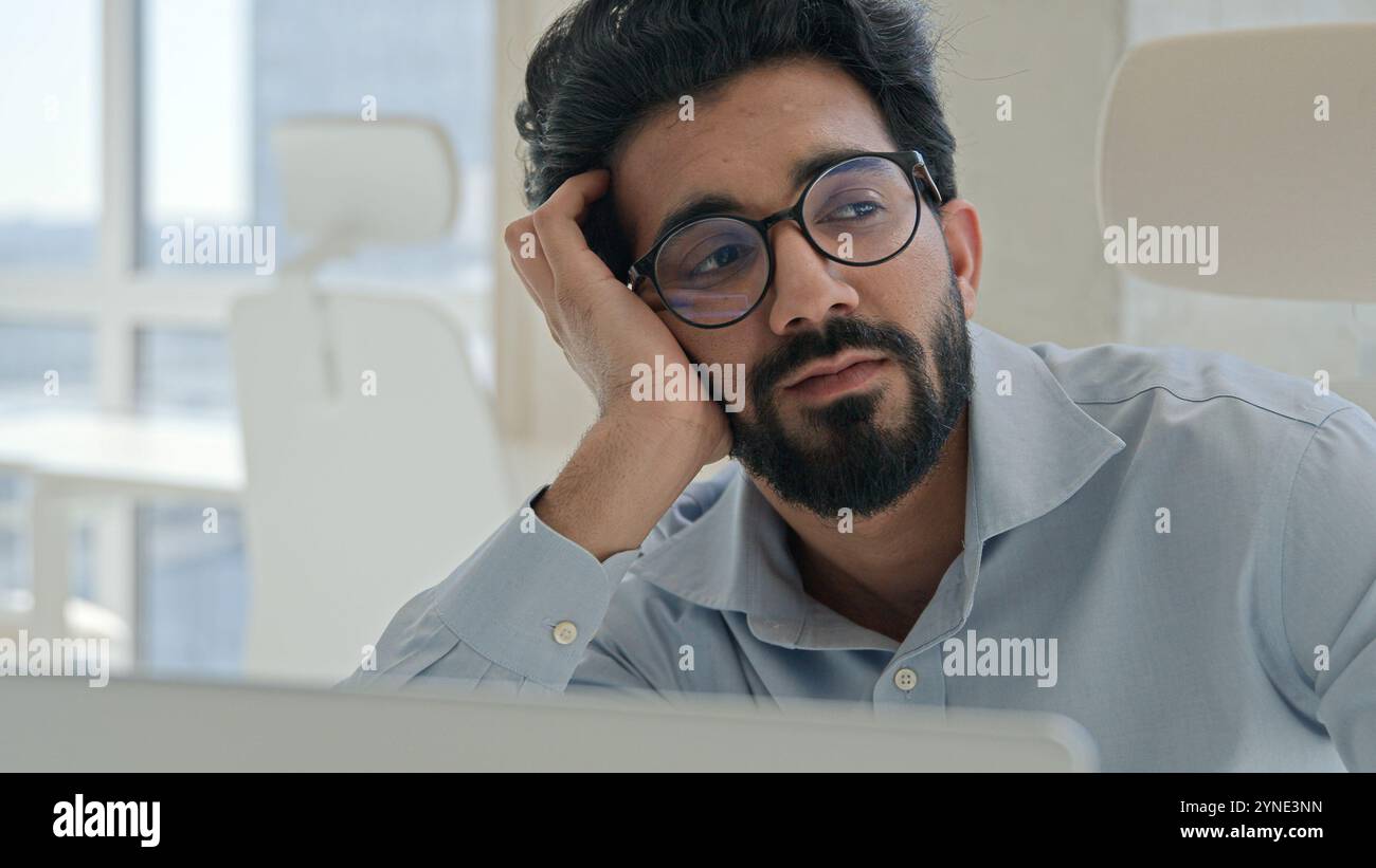 Sleepy tired arabian indian man hi-res stock photography and images - Alamy