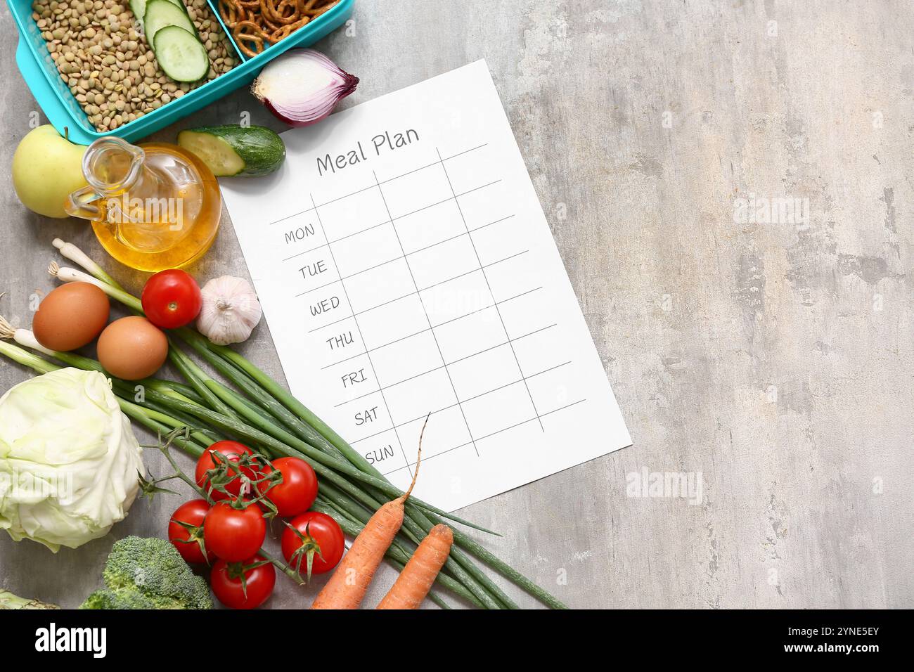 Healthy products and weekly meal plan on grey grunge background. Diet ...