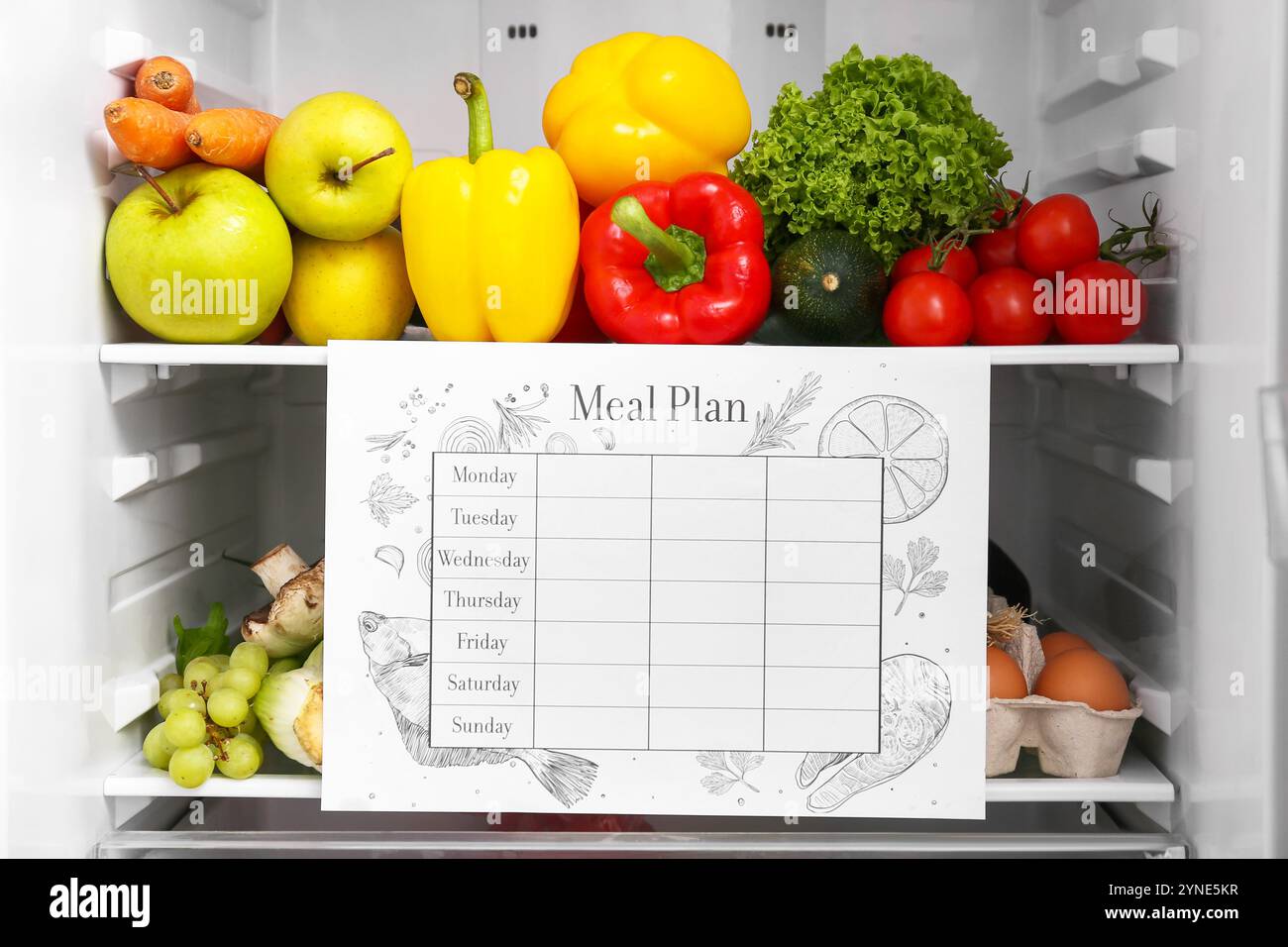 weekly meal plan near open fridge with healthy products Stock Photo - Alamy