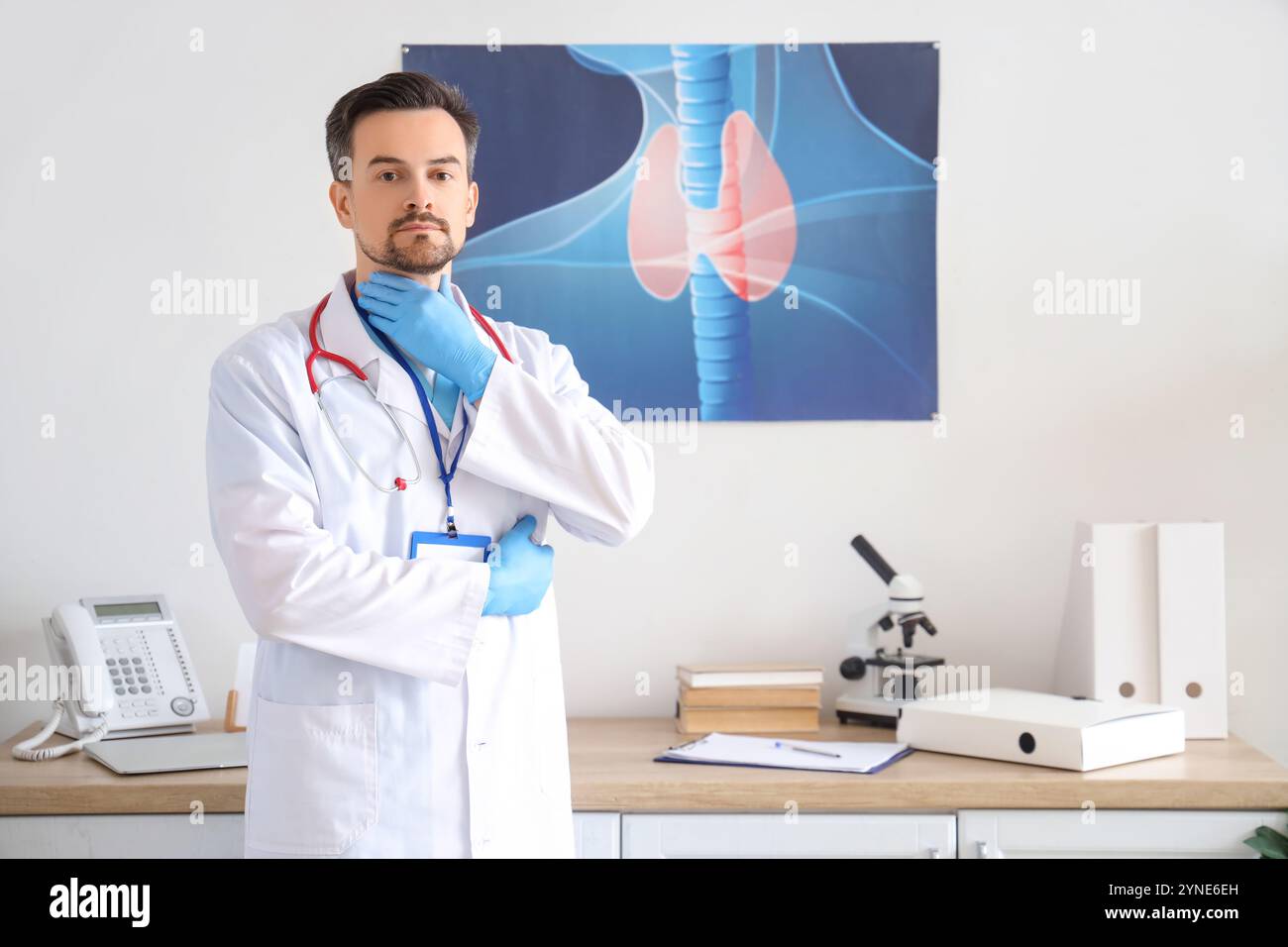 Male endocrinologist self-examining thyroid gland in clinic Stock Photo ...