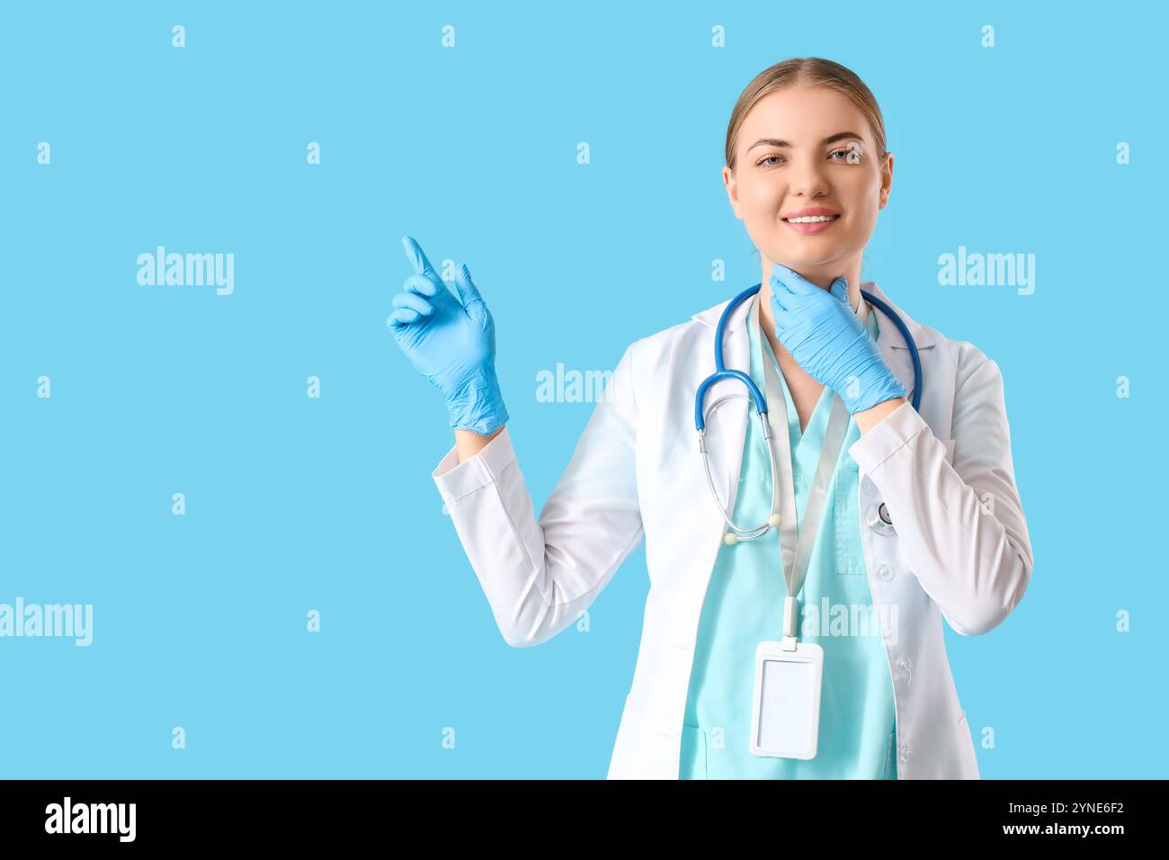 Female endocrinologist pointing at something on blue background Stock ...