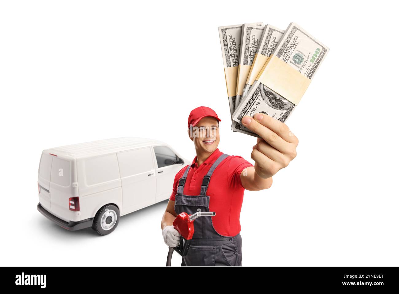 Gas station worker with a fuel hose holding money and standing in front ...