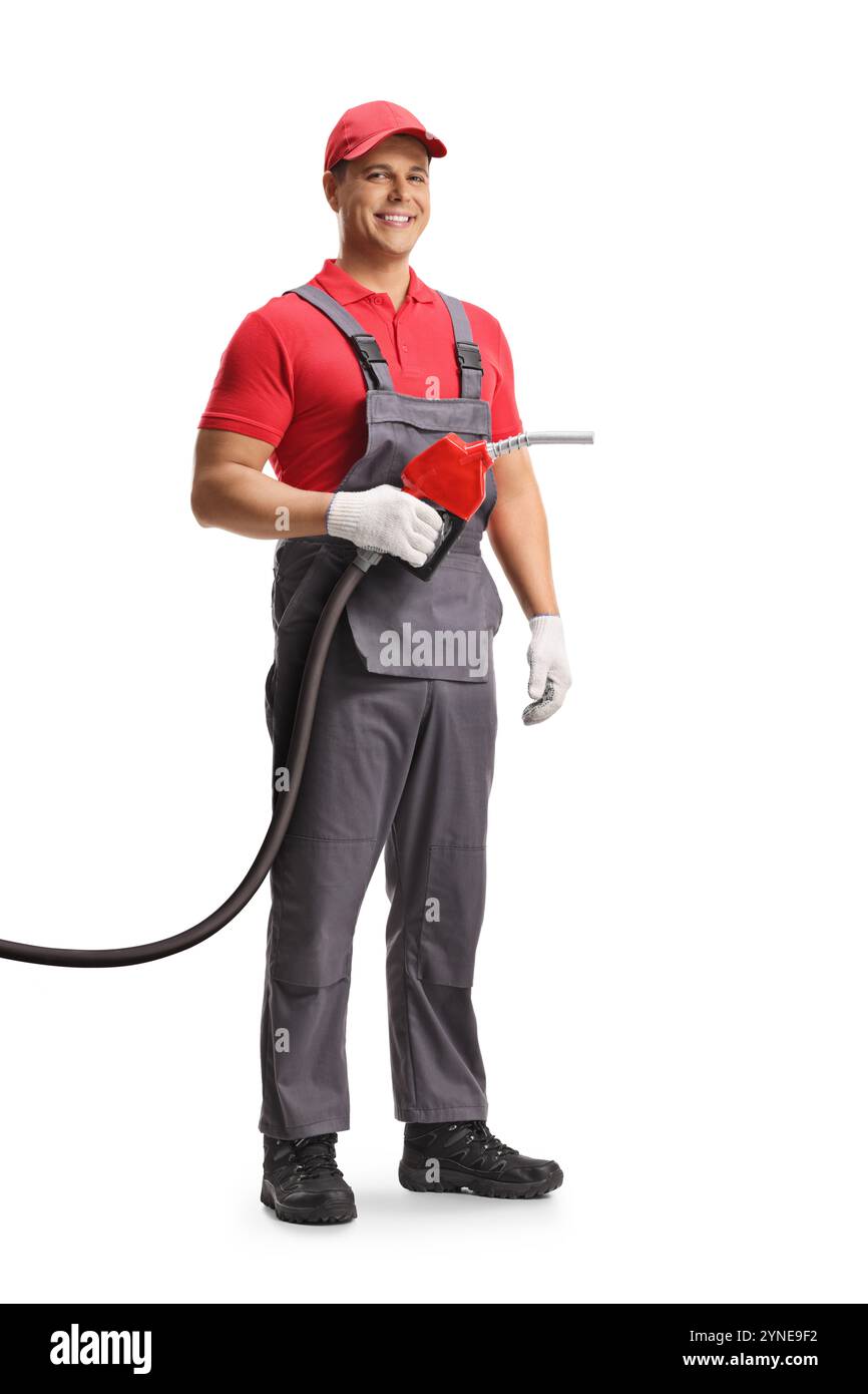 Full length portrait of a gas station worker with a refueling hose ...