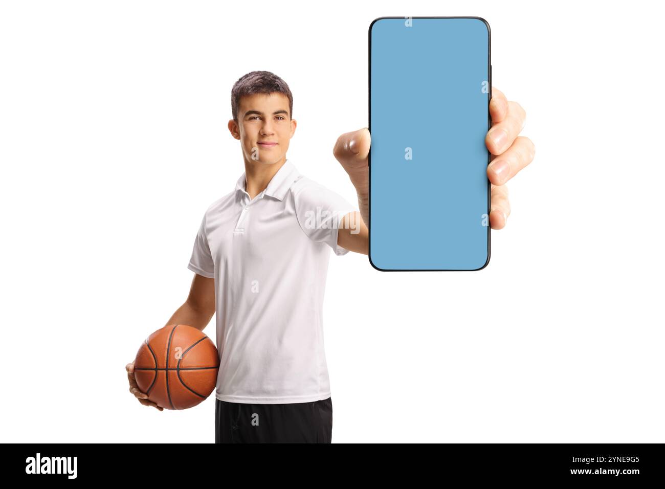Guy holding a basketball and showing a phone screen isolated on white ...