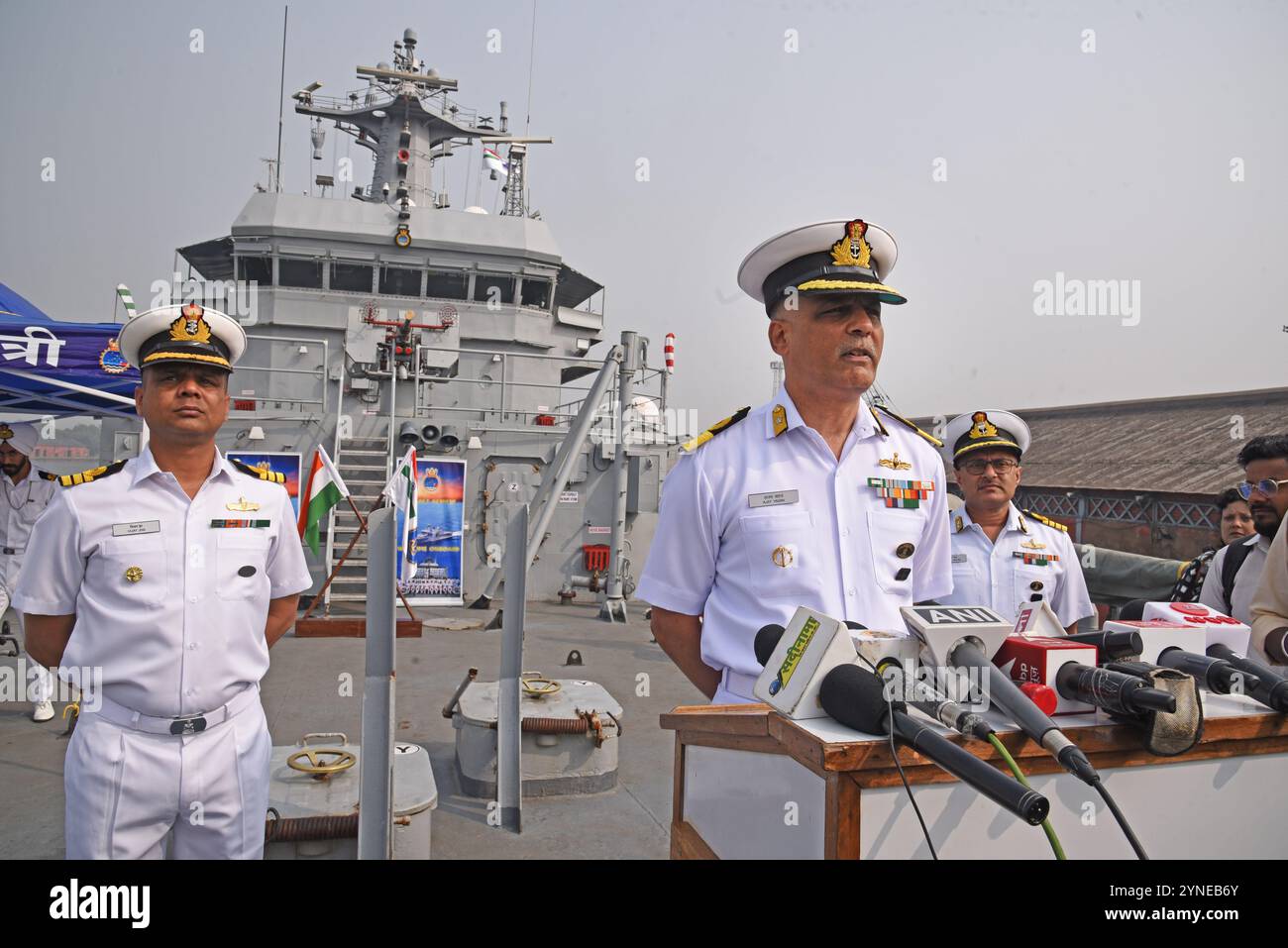 A Navy sailor explains for the visitors at INS Savitri during Indian ...