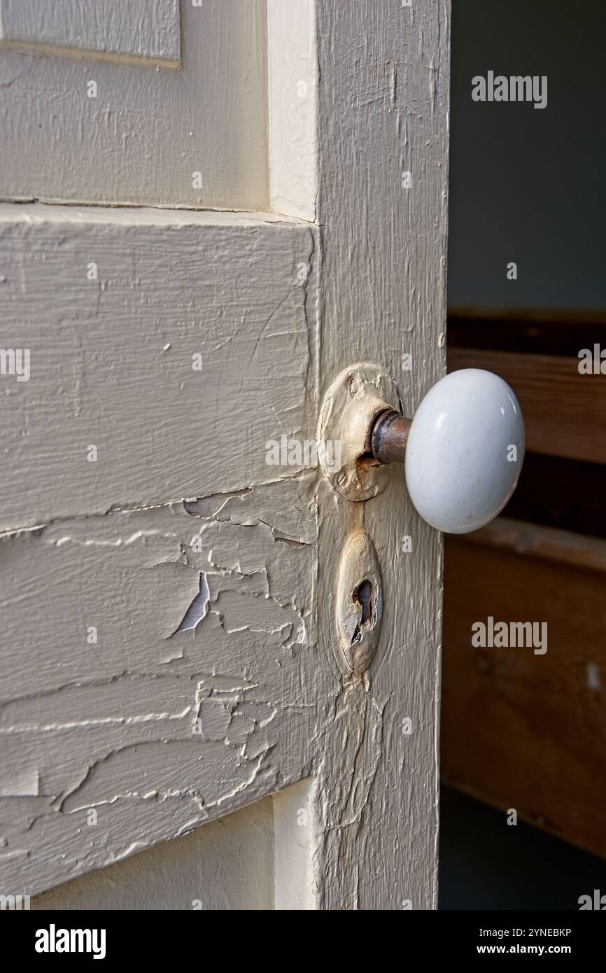 Weathered old panel door left ajar with peeling paint Stock Photo - Alamy