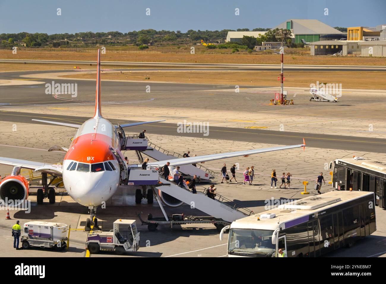 Luqa, Malta - 9 August 2023: Passengers getting off an easyjet flight ...