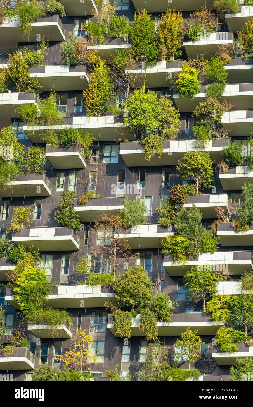 Vertical forest building with lush greenery and trees integrated into ...